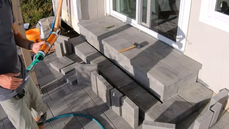 Homeowner transforms entryway with stairs made entirely from concrete ...