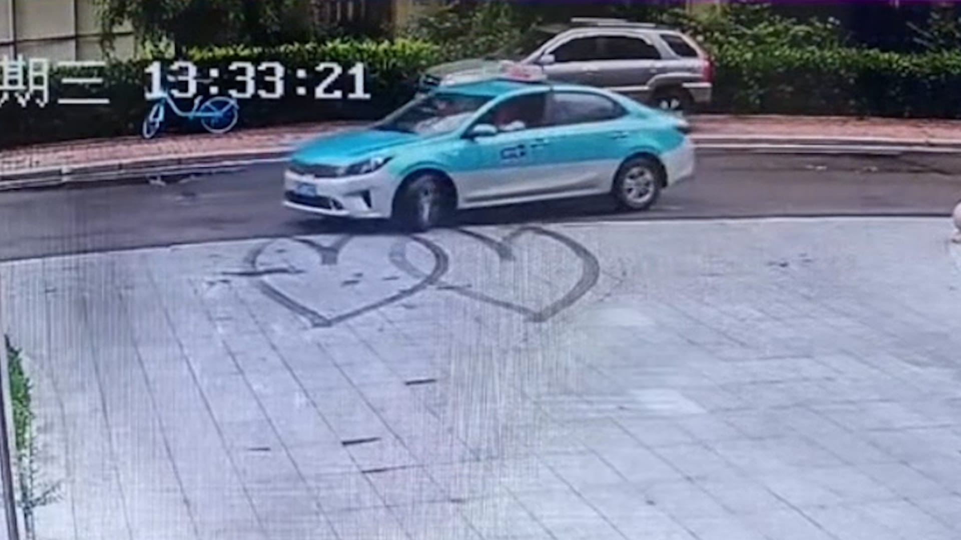 Taxi leaves double heart-shaped skid marks on pavement after accidental ...