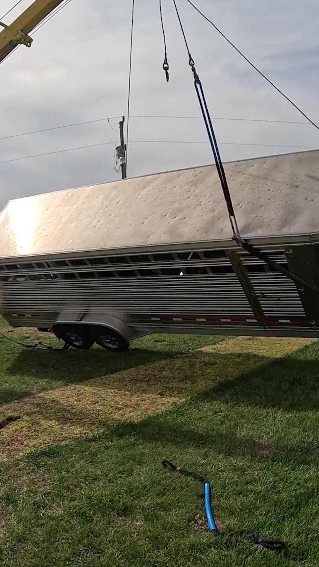 Lifting a livestock trailer back on its feet