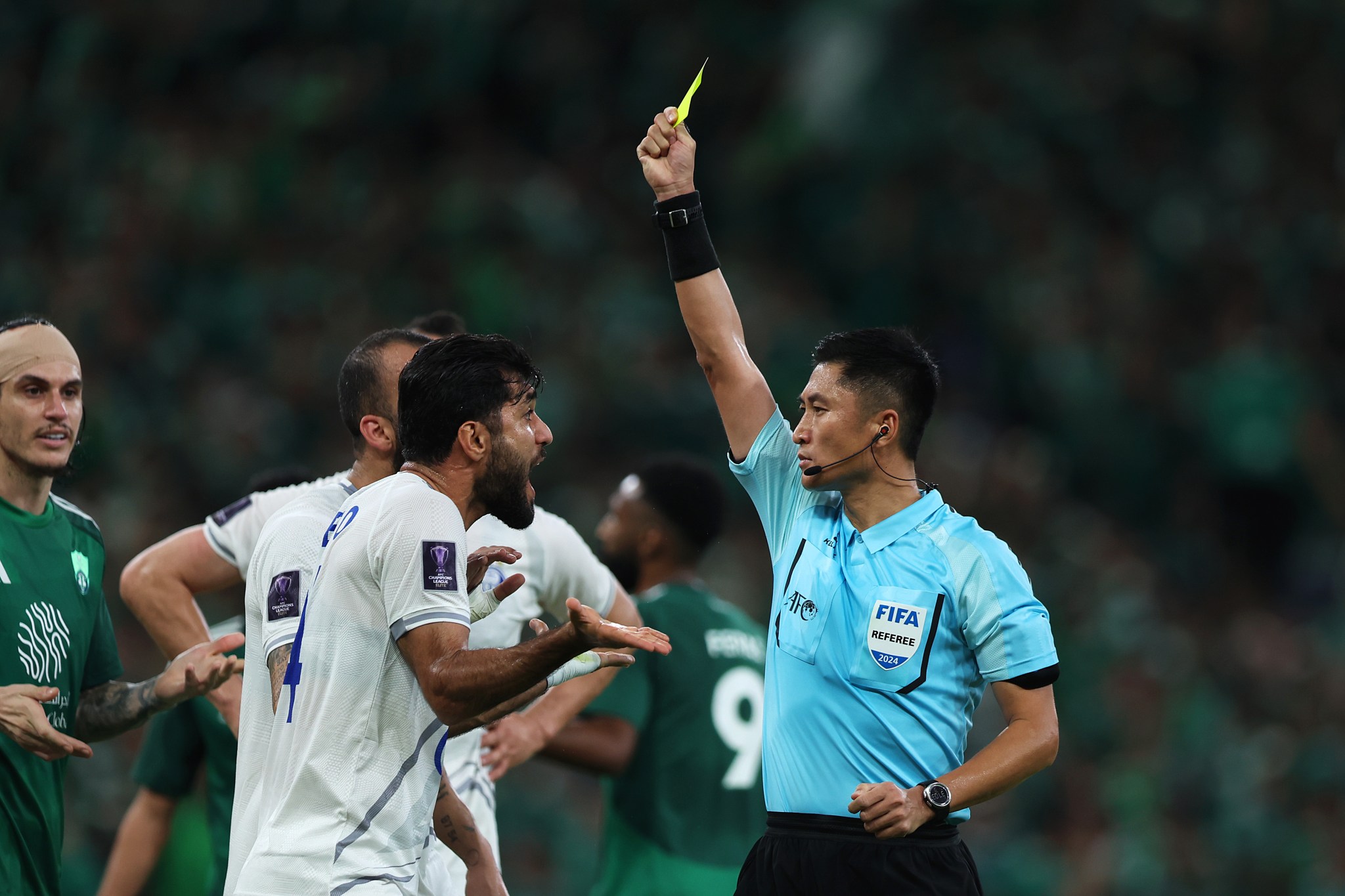 Chinese fans turn to 'Card Master' referee as World Cup begins without team