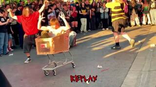 Metal fans joust using shopping carts at pop up concert