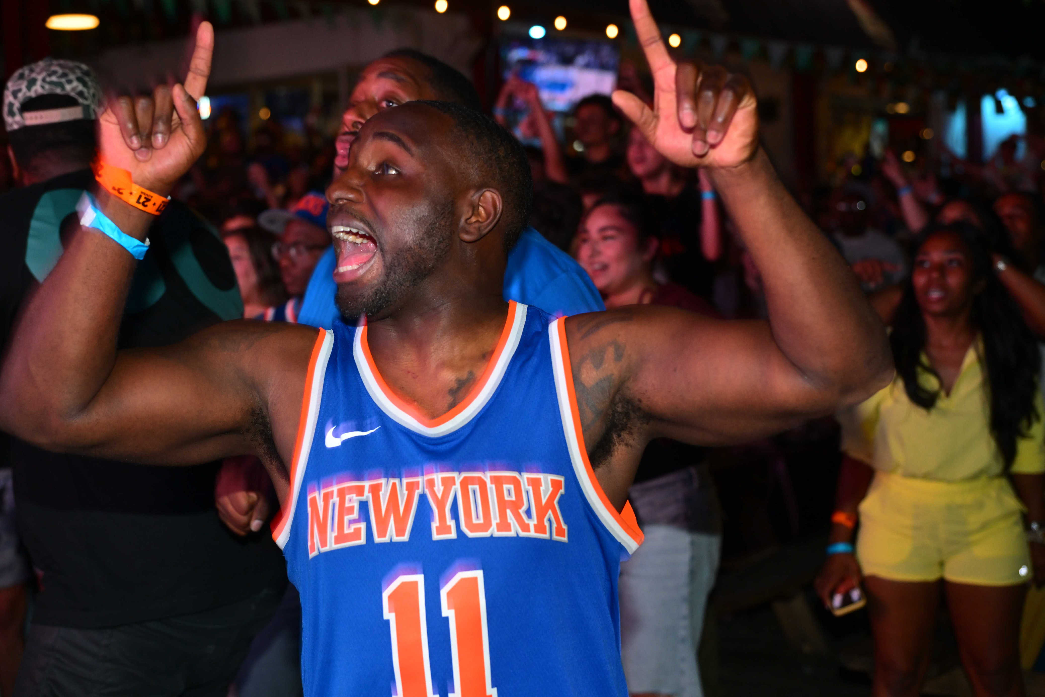 See it | Queens residents come together to watch Knicks’ historic ...