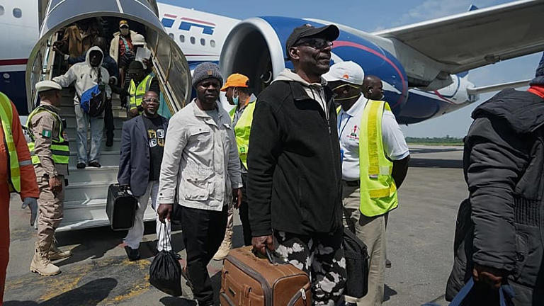 First group of Nigerians returns home after anti-immigration protests ...