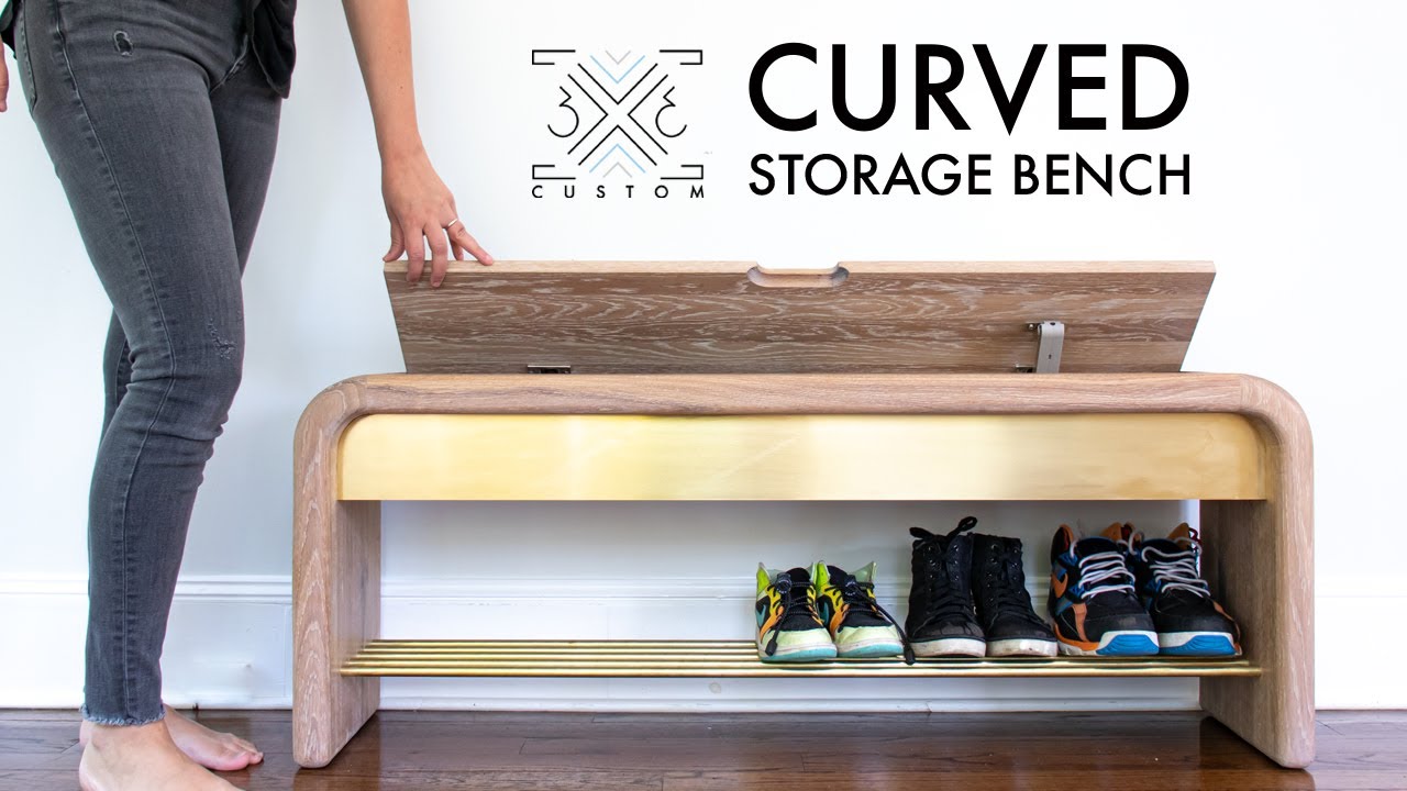 Storage bench with curves and brass accents