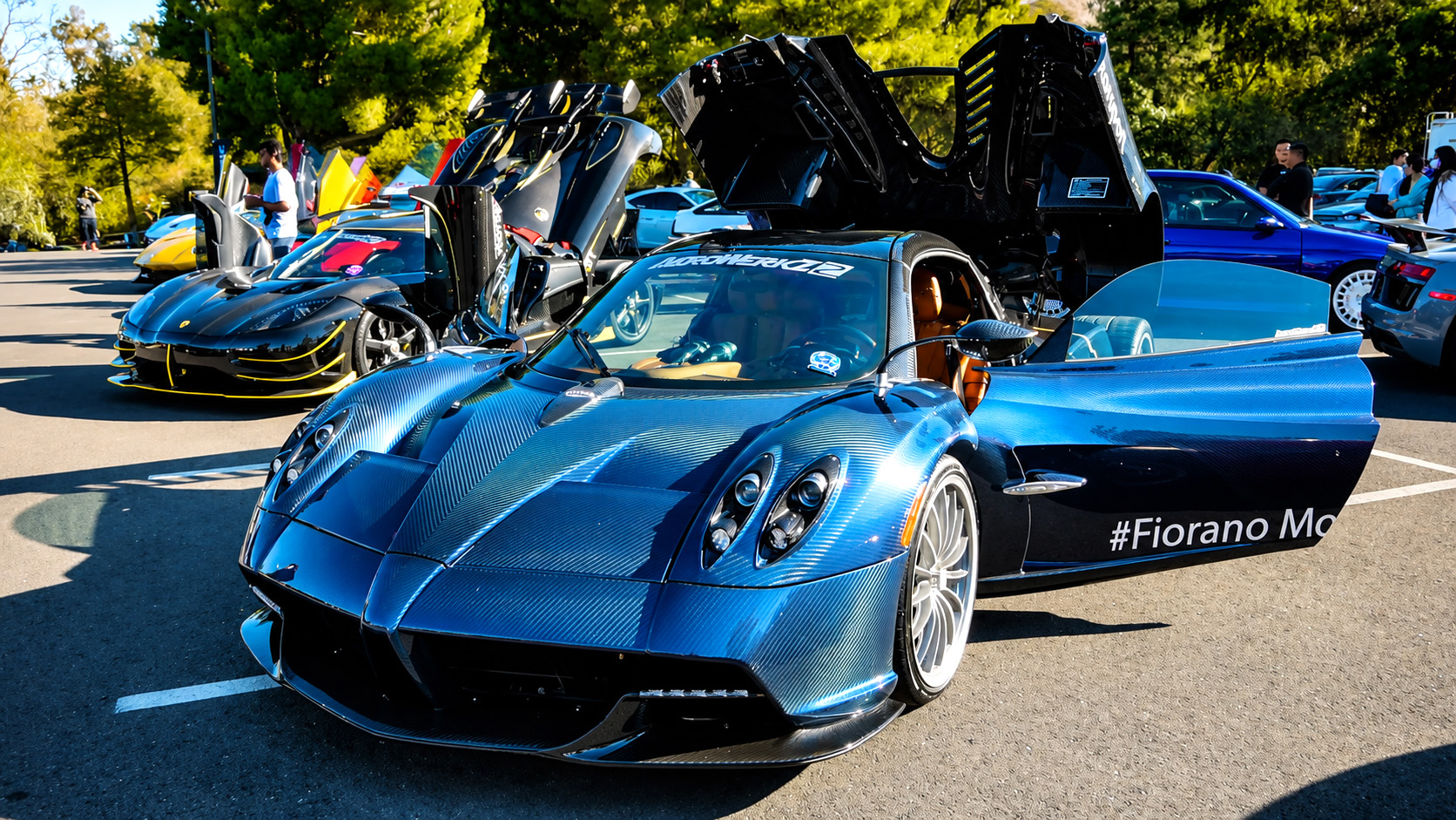 Real gold Koenigsegg joins a rare Pagani hypercar showcase