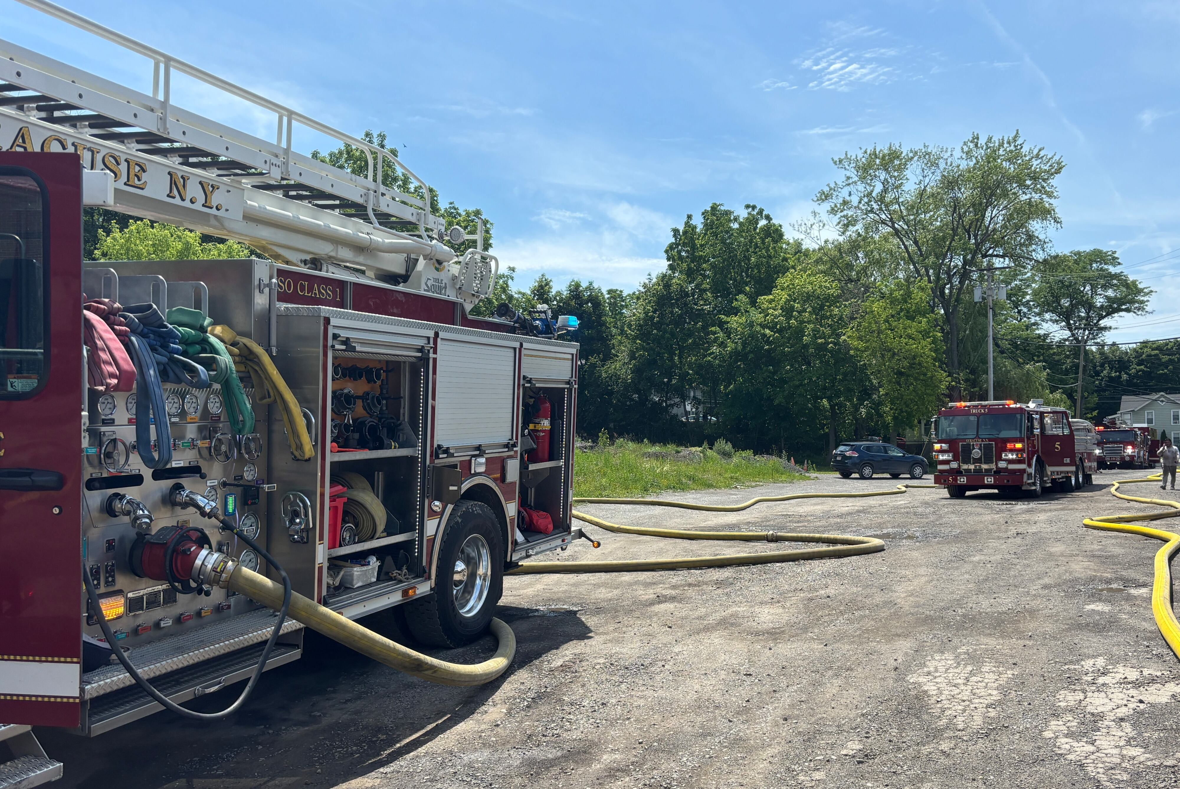 Syracuse firefighters battle auto shop fire in 90-degree heat