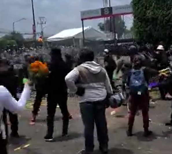 Riot police clash with protesters hurling stones outside World Cup ...