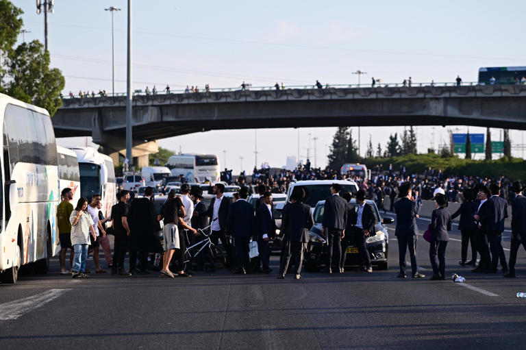 Haredi draft protests shut down highways, trains for two hours, scuffle ...