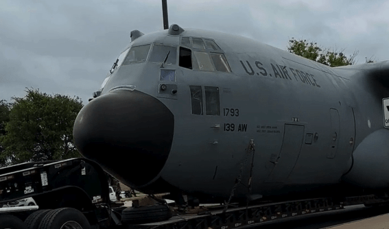 Video: C-130 military plane transported from the airport to GAFB