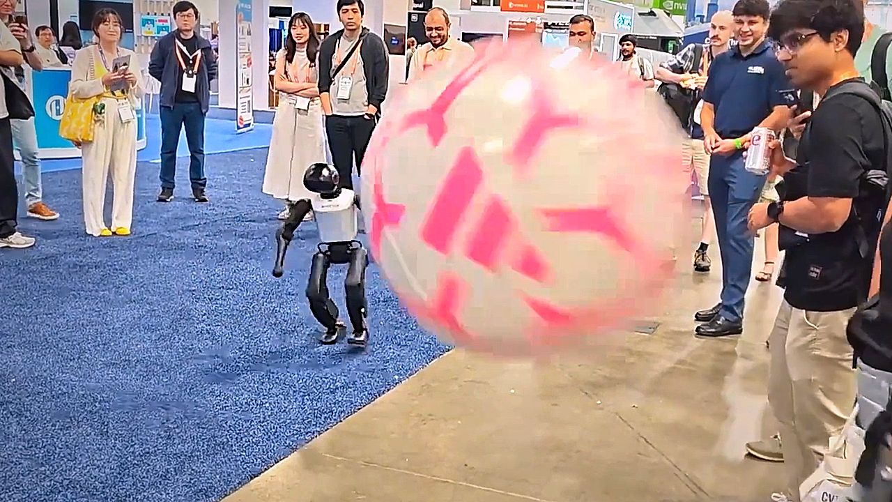 Robot kicks ball into camera during Denver tech conference