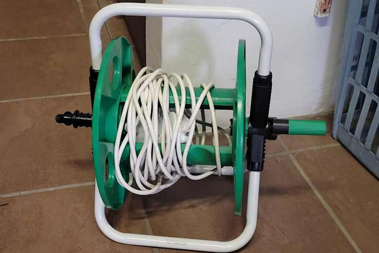 I used a hose holder for cord storage, and it was so smart