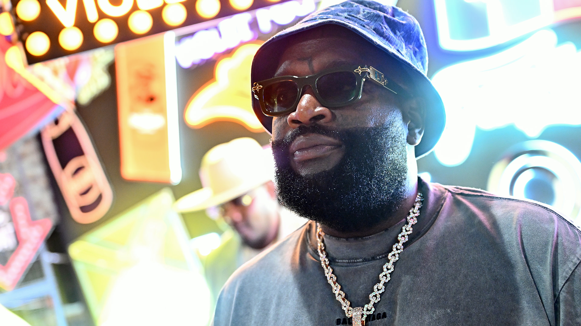 Rick Ross responds to viral video showing him boarding Frontier plane ...
