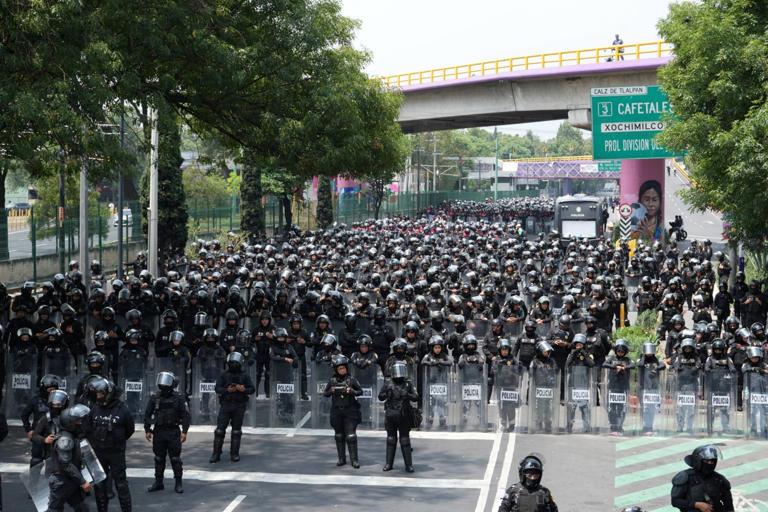 Riot police clash with protesters hurling stones outside World Cup ...