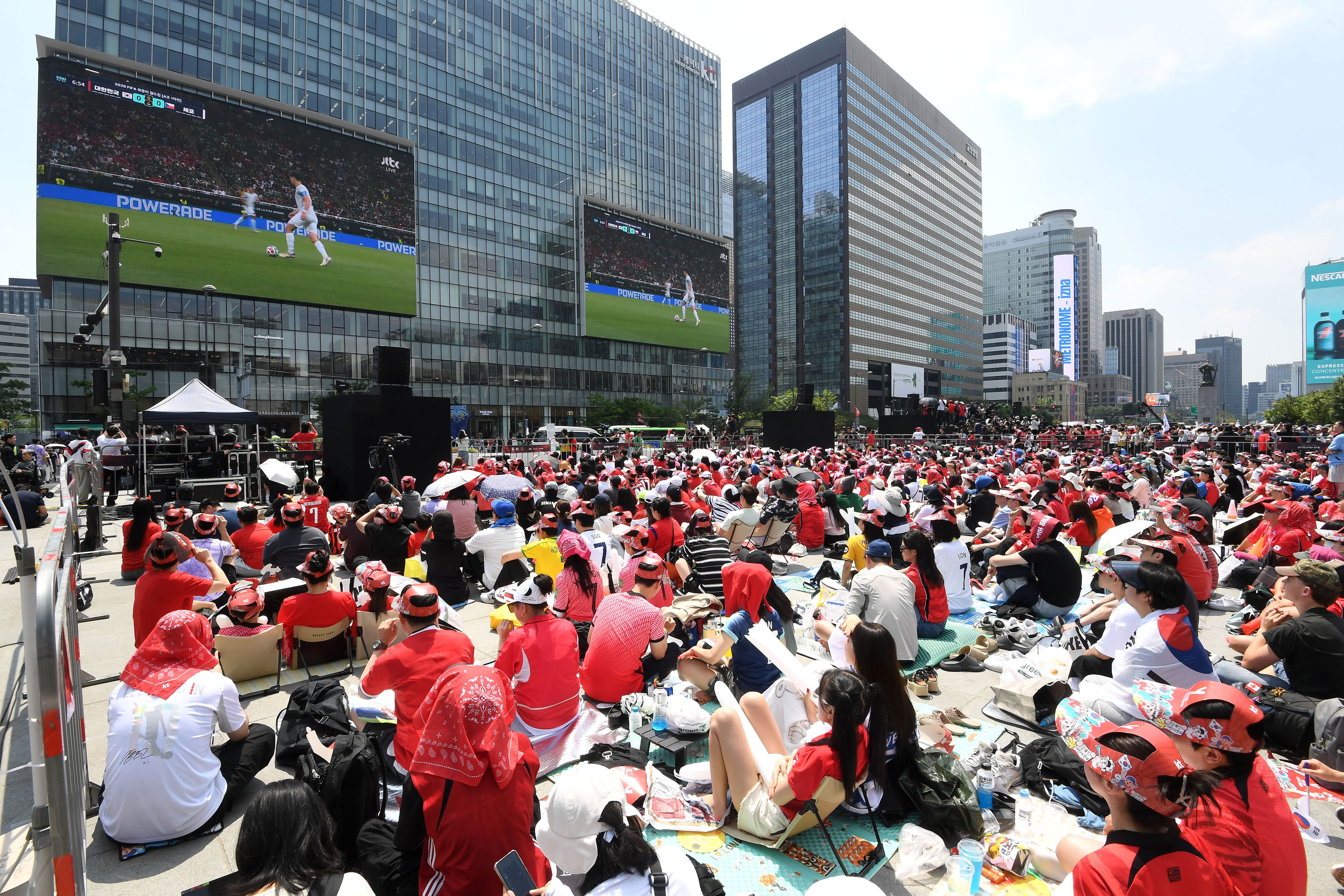 Red-clad fans cheer South Korea at Gwanghwamun