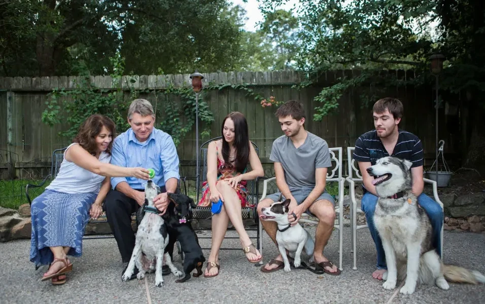 Sister uninvited from family party over treating dogs like kids