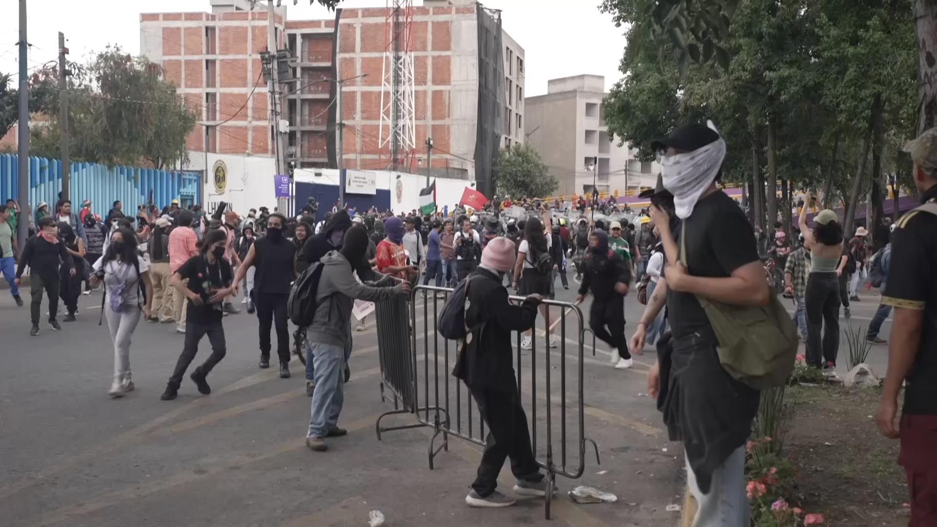 Protesters and police clash near Mexico City stadium during World Cup ...