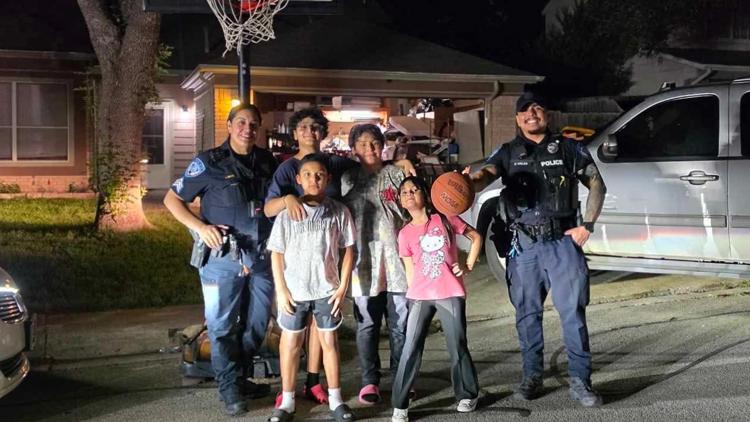 Watch: Converse PD joins in game of neighborhood basketball after ...