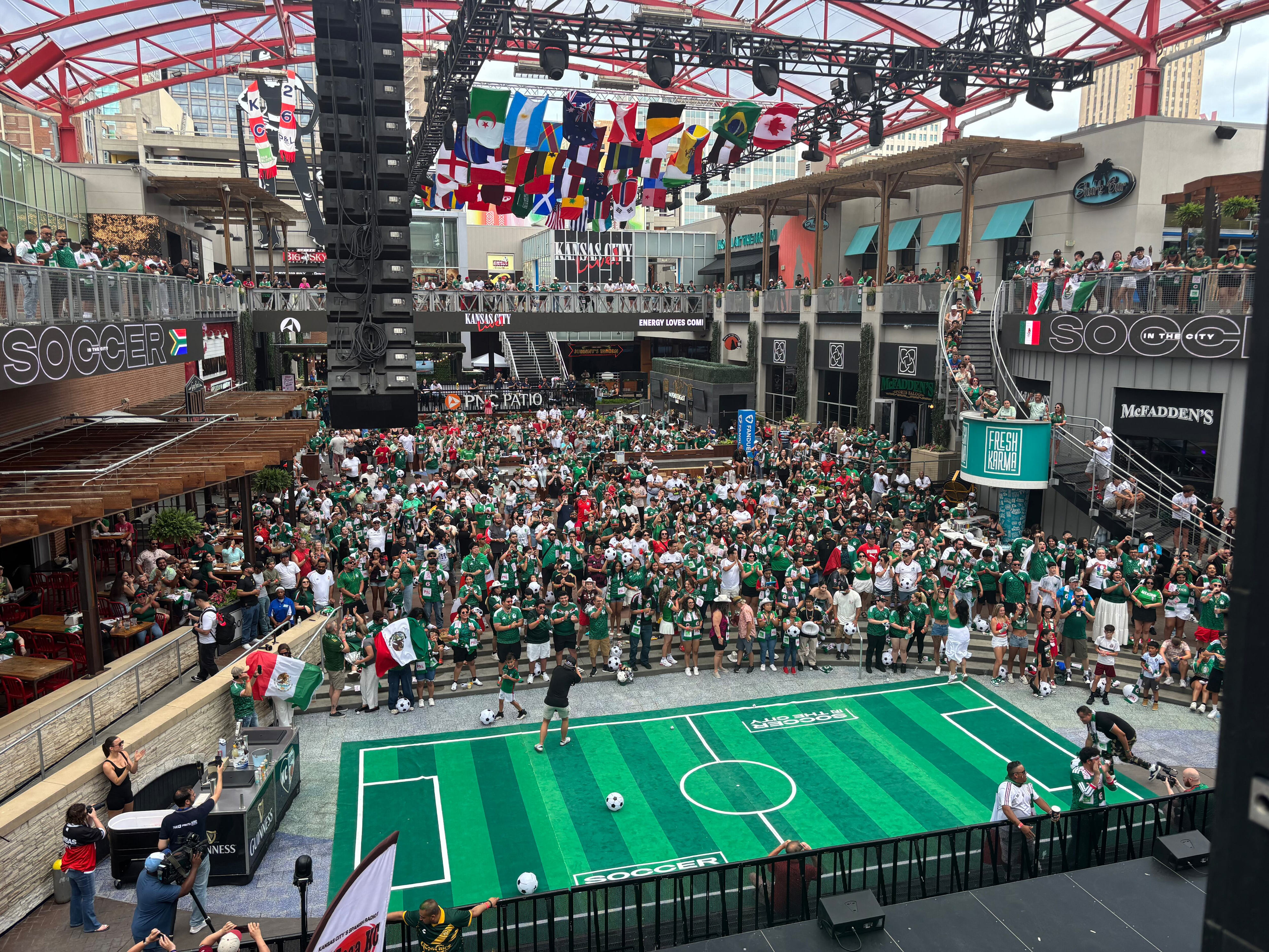 Hundreds gather at Power and Light for World Cup opening match