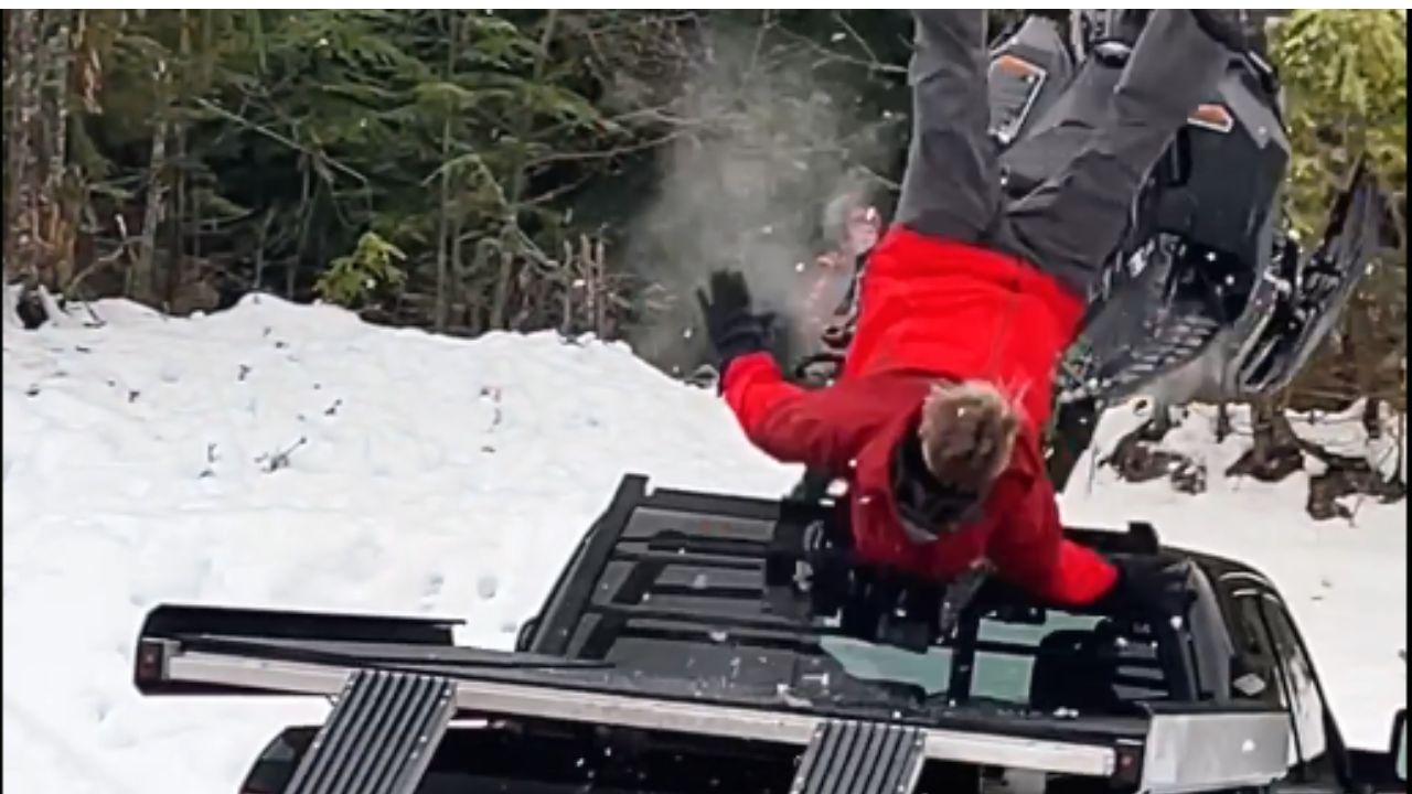 Hilarious snowmobile fail - Clever guy tries to load snowmobile on the ...
