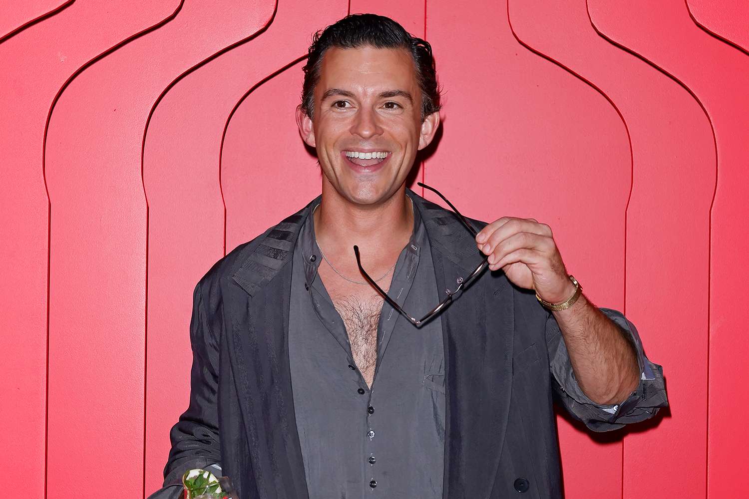 Jonathan Bailey smolders in chest-baring shirt and suit for Martini Man ...