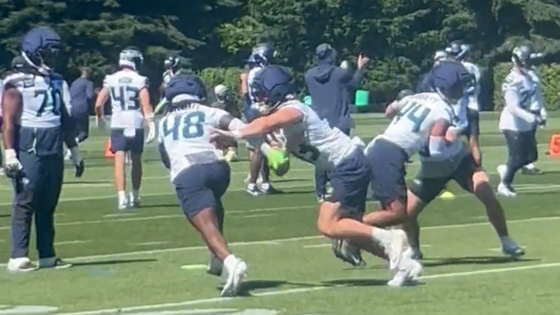 Coach Jay Harbaugh leads Seahawks through special-teams drills in minicamp