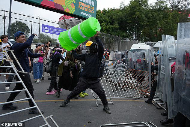 Chaos erupts outside Mexico City World Cup stadium as protesters fight ...