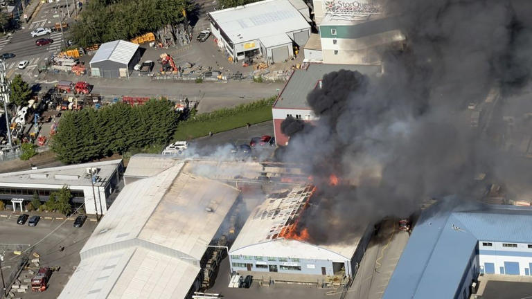 Large fire damages plumbing warehouse in Ballard, roof partially collapses