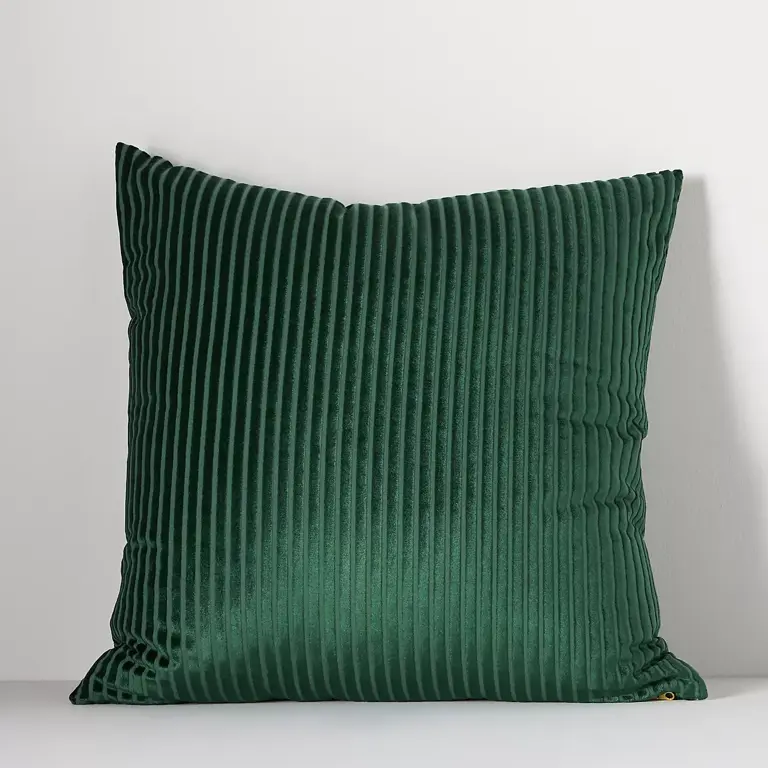 Zooey Deschanel reimagines antique-style decor with a dark green sofa ...