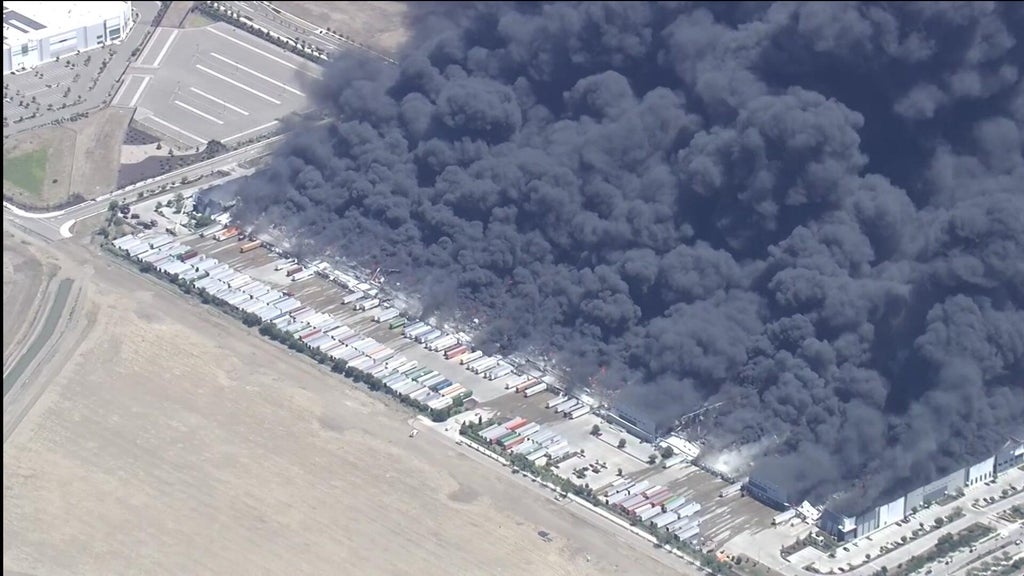 Tracy warehouse fire produces large black plume of smoke; building ...