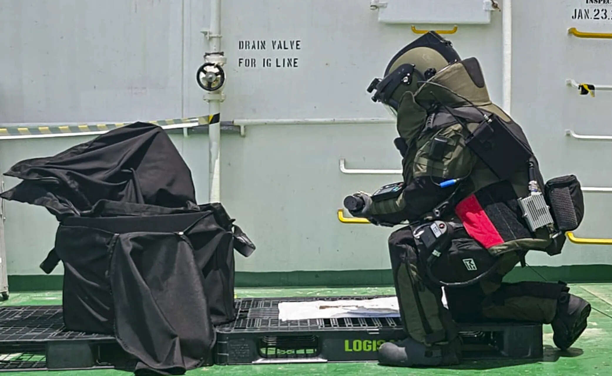 Navy removes unexploded warhead from struck ship