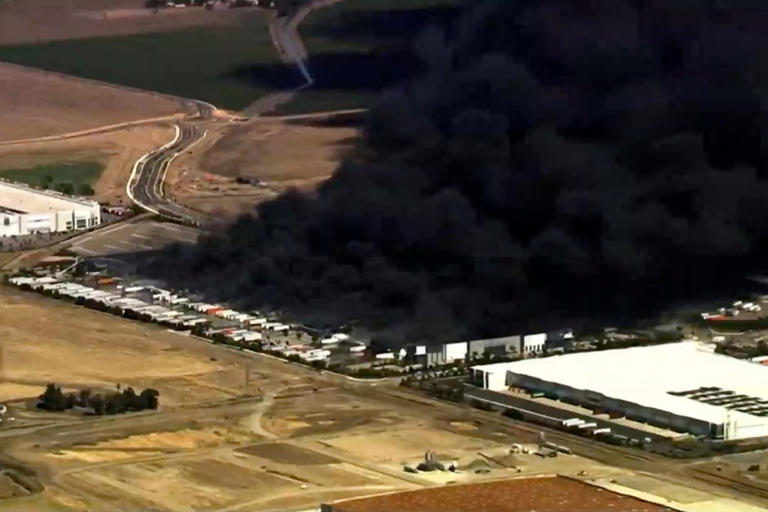 Tracy medical warehouse fire sends plumes of black smoke into air as ...