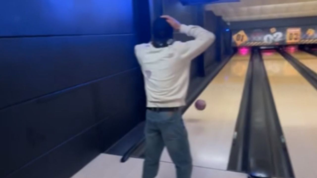 Bowling throw goes upward and strikes overhead screen