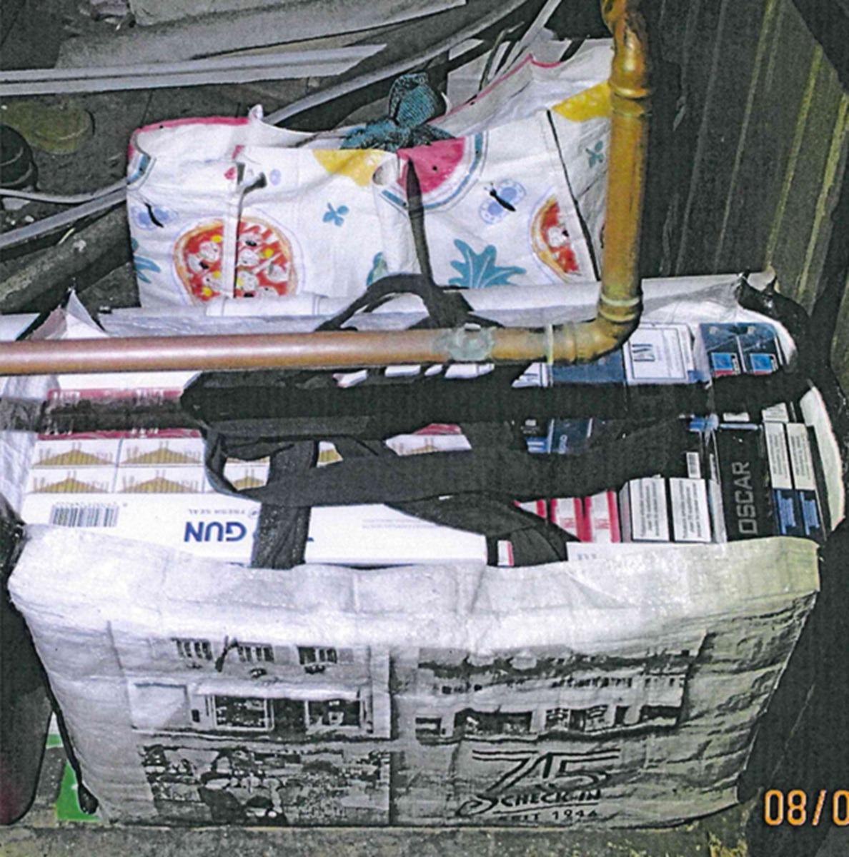 Throwing knives and counterfeit cigarettes found in off licence raid