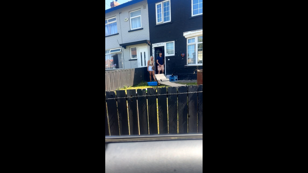 Tiny dachshund chases woman around the yard!