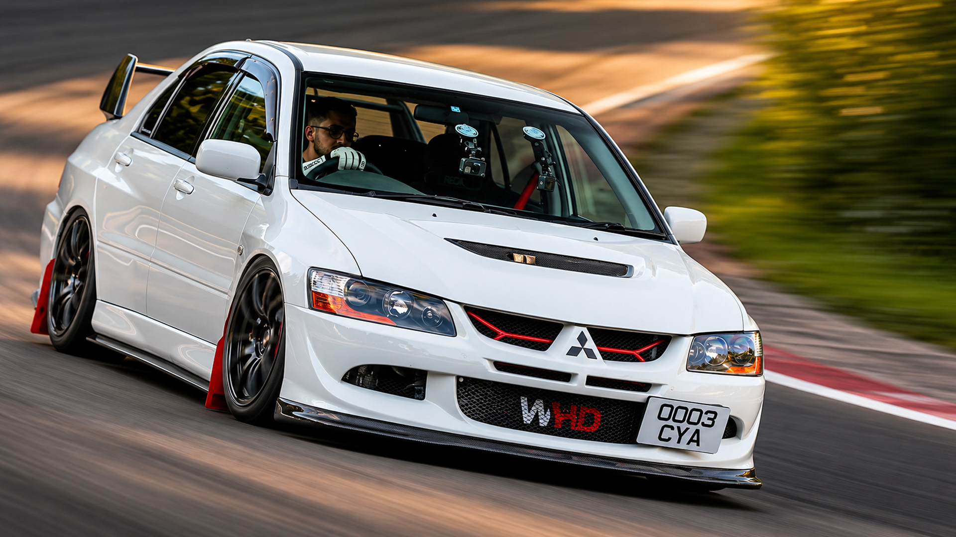 Modified Mitsubishi Evo attacks the race track