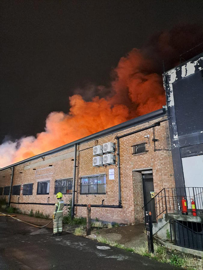 Huge fire rips through warehouse as 150 firefighters tackle blaze