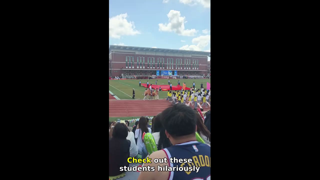 Students parade with giant camel cutout at Chinese school sports day