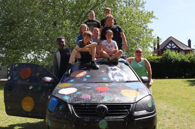 Pupils turn donated car into colourful space sculpture