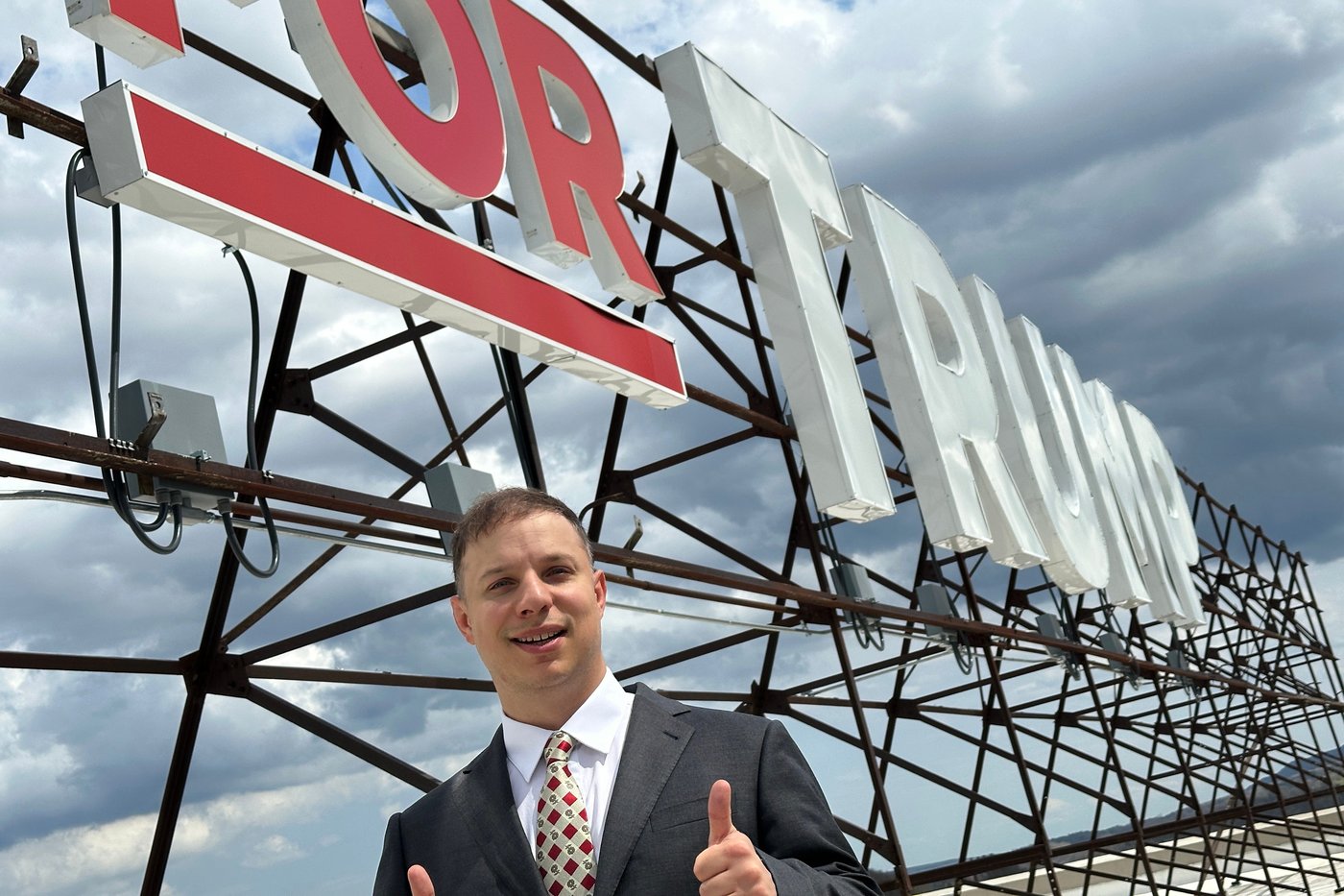 Can the man behind a giant pro-Trump sign ride the president’s praise ...