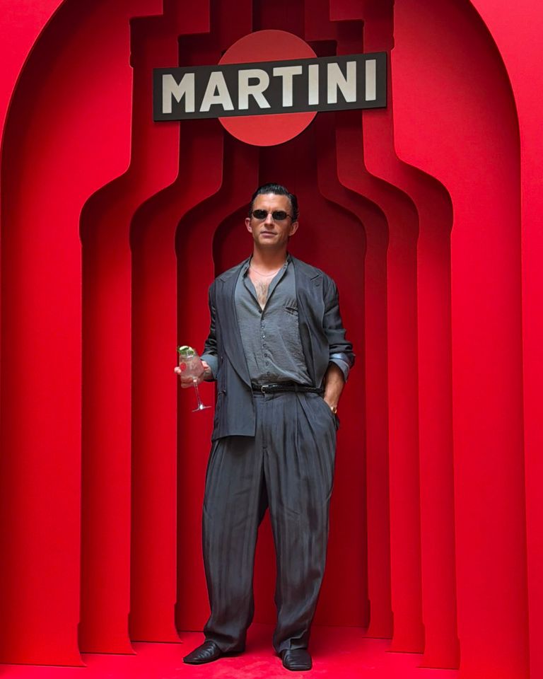 Jonathan Bailey smolders in chest-baring shirt and suit for Martini Man ...