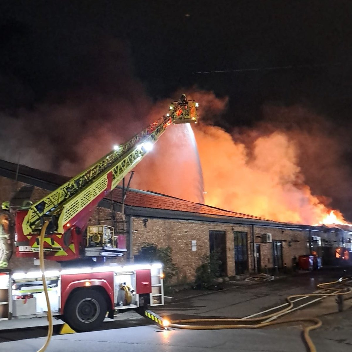 Huge fire rips through warehouse as 150 firefighters tackle blaze