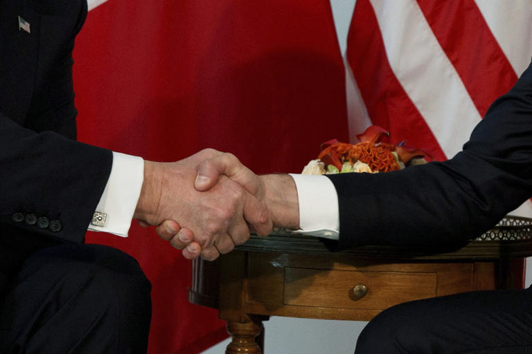From white knuckles to open barbs, Trump and Macron bring a rocky ...