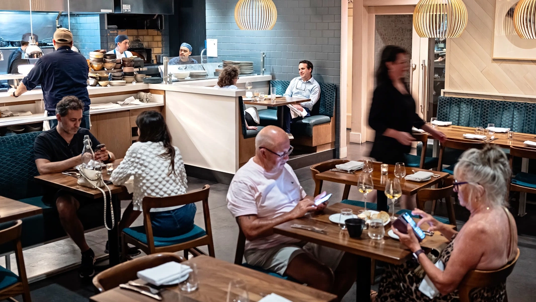 Why restaurants seat only complete parties