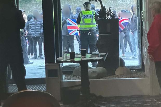 Police descend on hotel outside Glasgow as wave of protests rage on