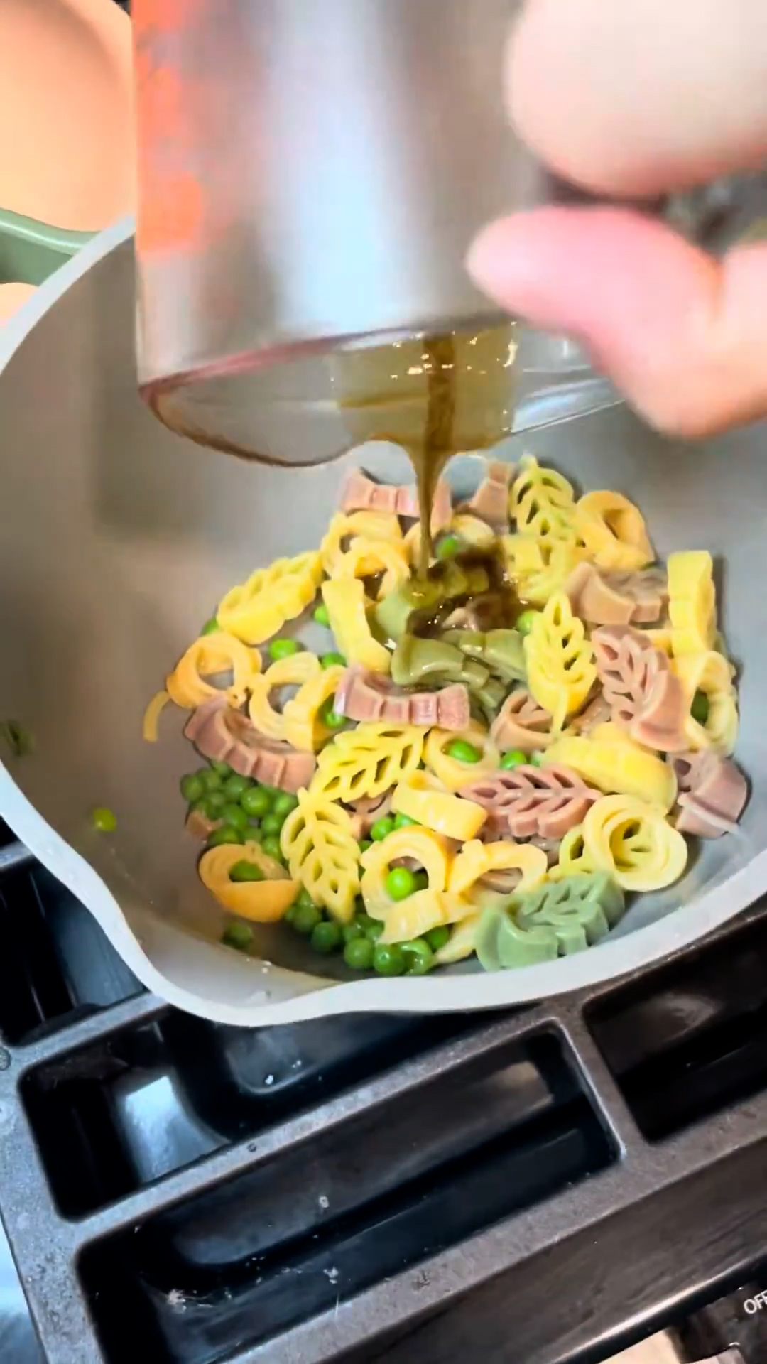 Simple brown butter sauce coating pasta with peas everyone will enjoy
