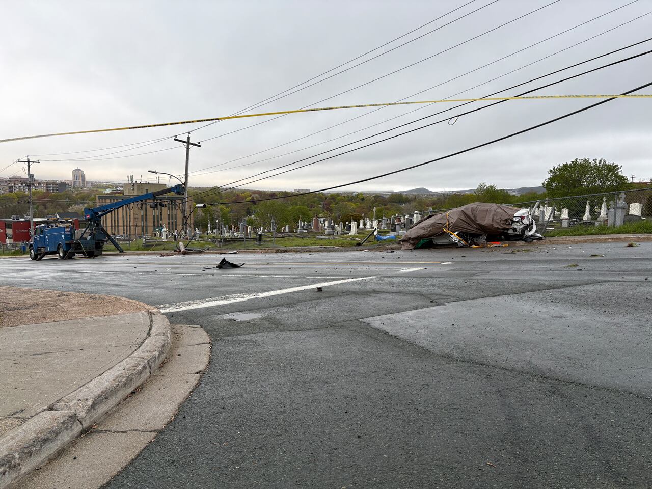 Power pole left dangling, road closed after 'serious' car rollover in ...