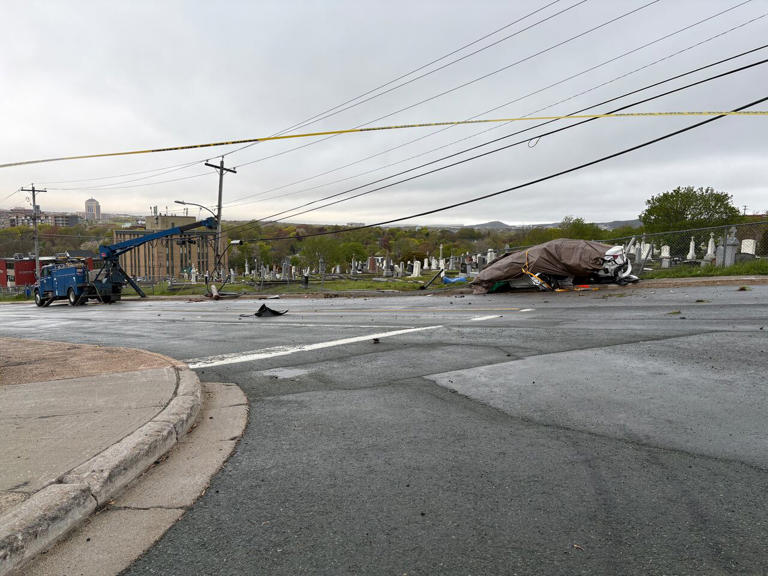 Power pole left dangling, road closed after 'serious' car rollover in ...