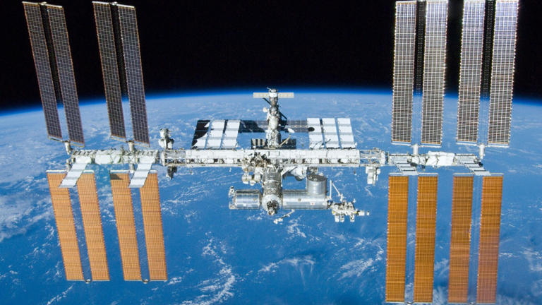 The space station circles Earth at about 17,500 miles per hour