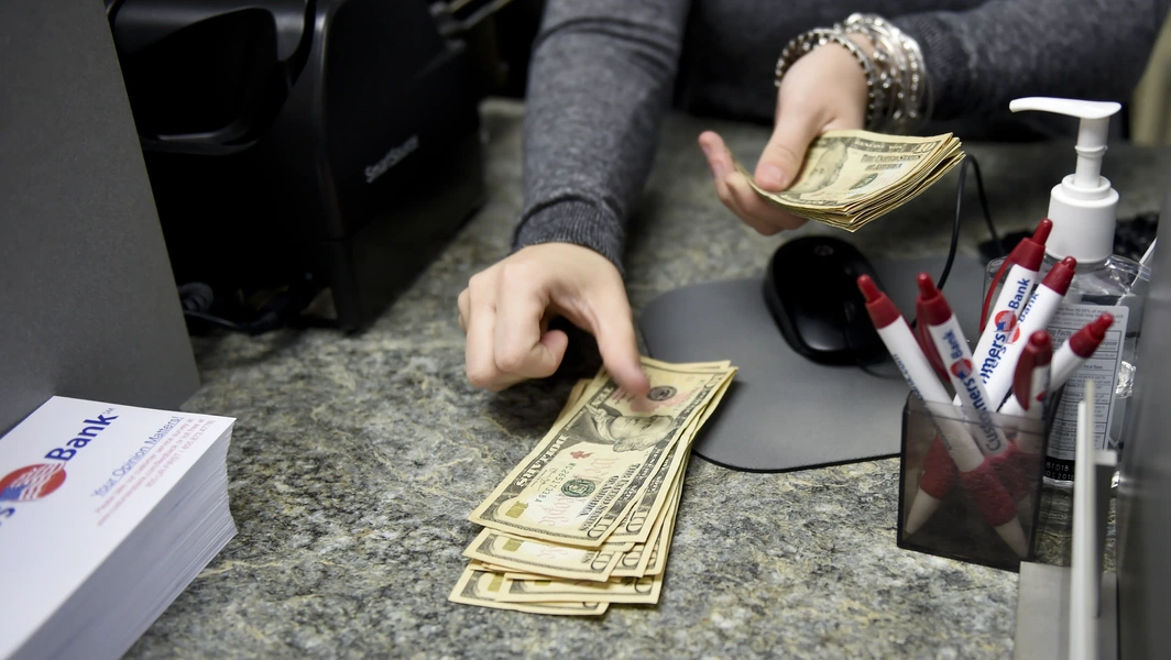 Withdrawing over $5,000: Rules, procedures, and risks