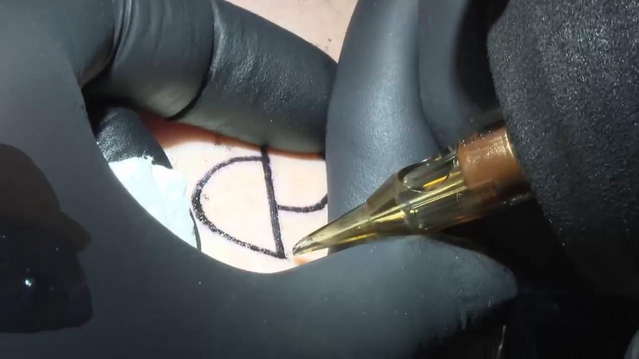 German nonprofit promotes organ donation with tattoo campaign at parliament